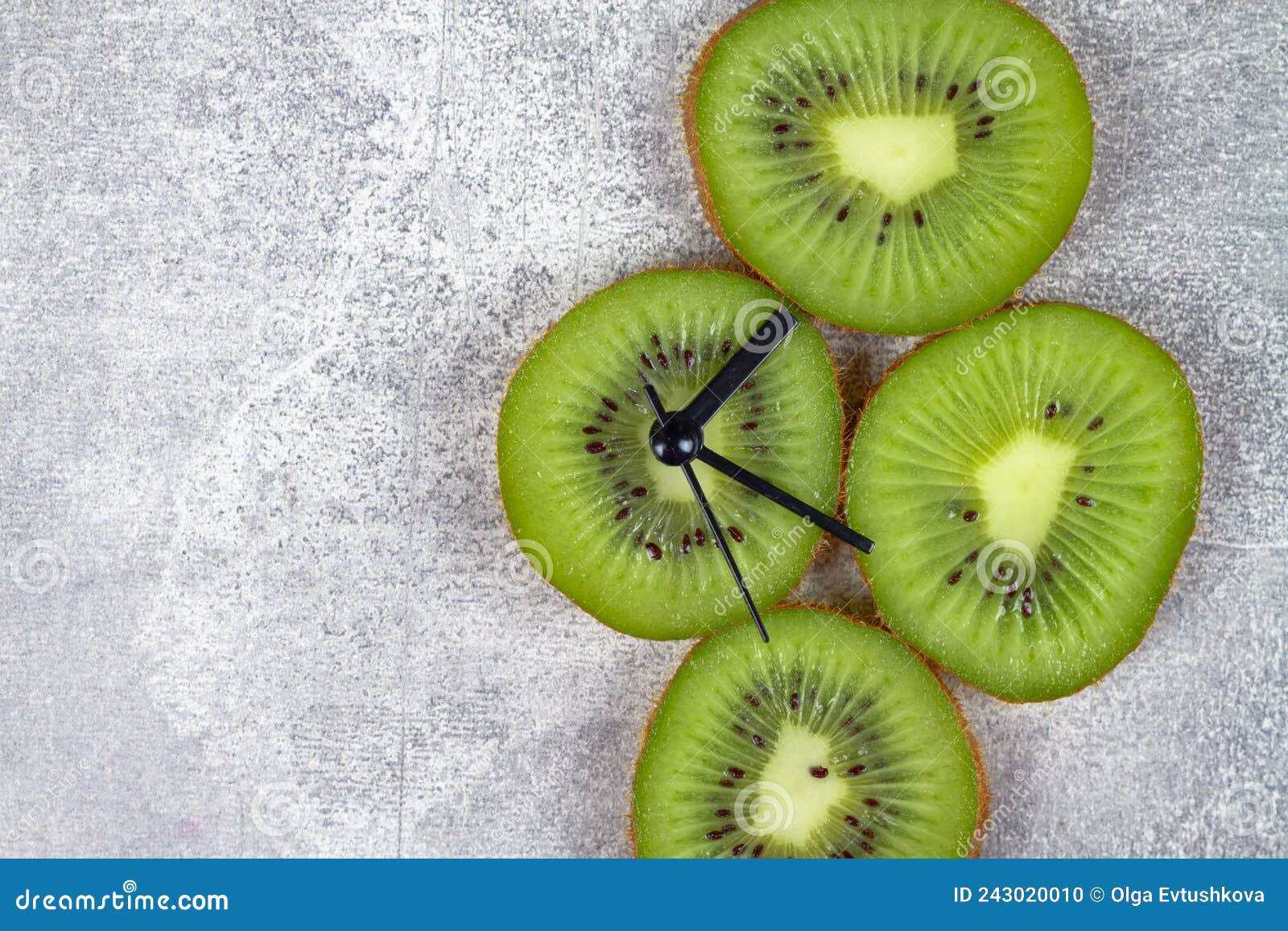 A Clock Made of Green Kiwi Fruit Shows the Time Stock Photo - Image of ...