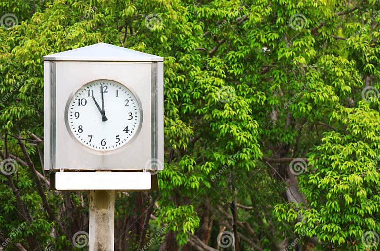 Clock in the park stock photo. Image of arrow, alley - 26166028