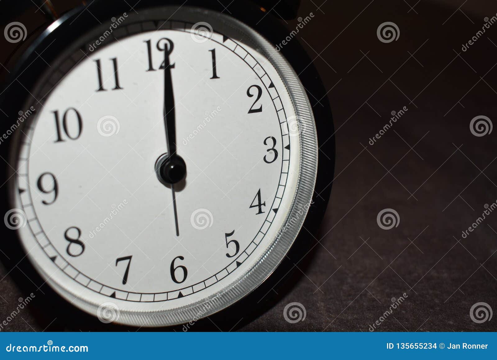 Clock Pointing To Different Times Stock Photo - Image of table, black ...