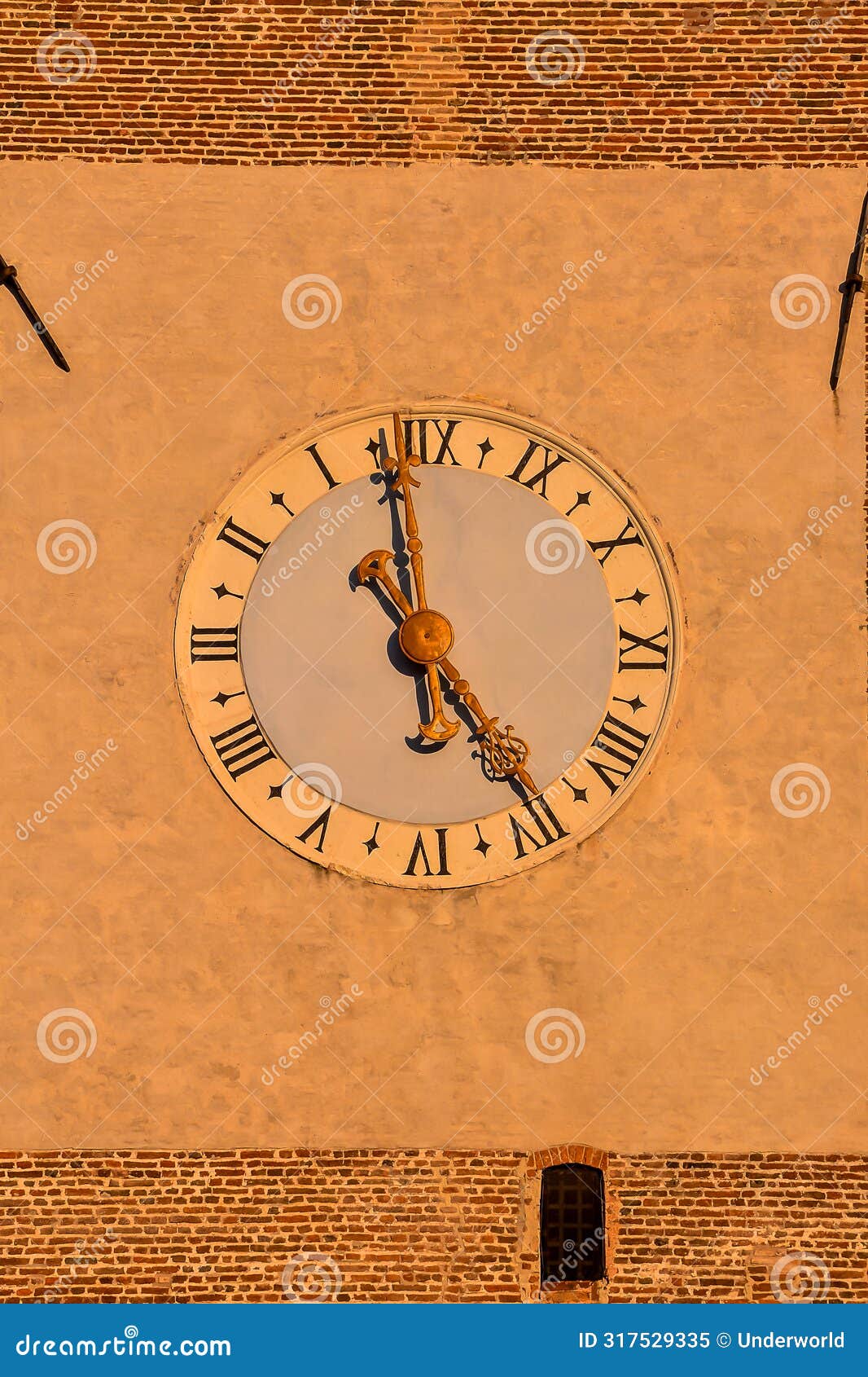 A Clock with Roman Numerals on a Wall Stock Image - Image of hour ...