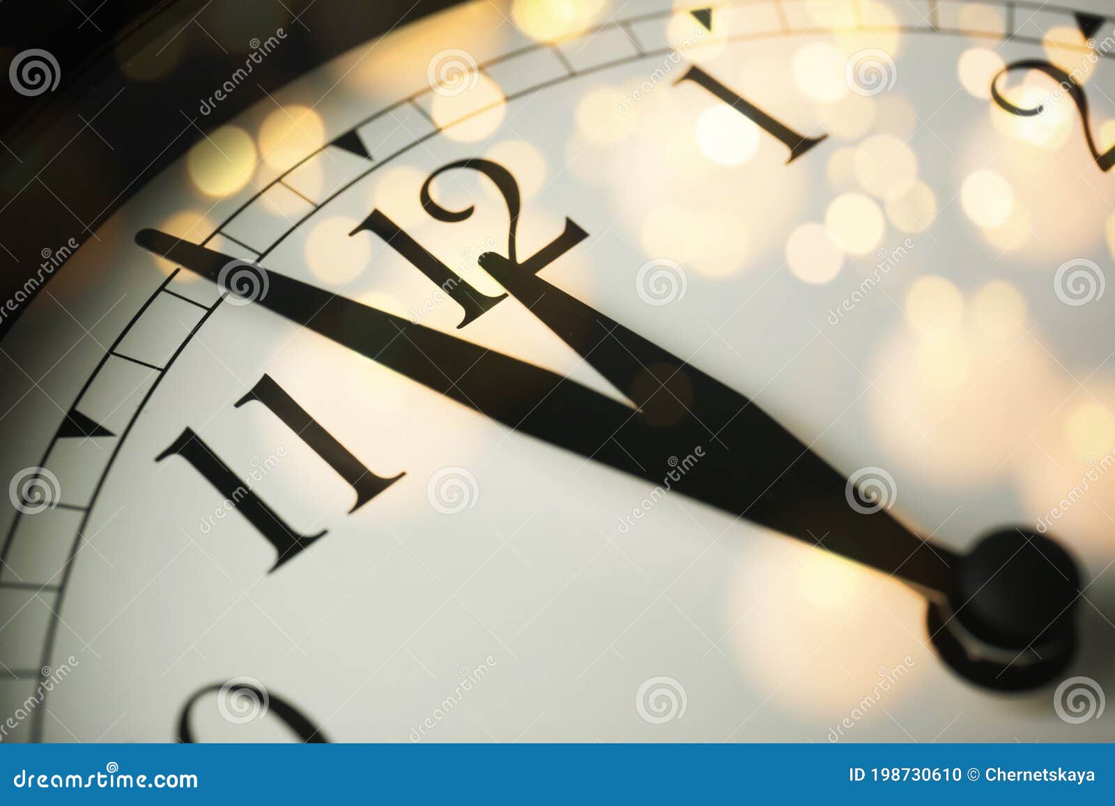Clock Showing Five Minutes Till Midnight with Bokeh Effect, Closeup ...
