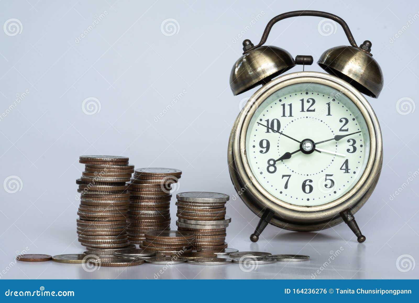 A Clock And Stack Of Coin On White Background. Savings And Investment ...