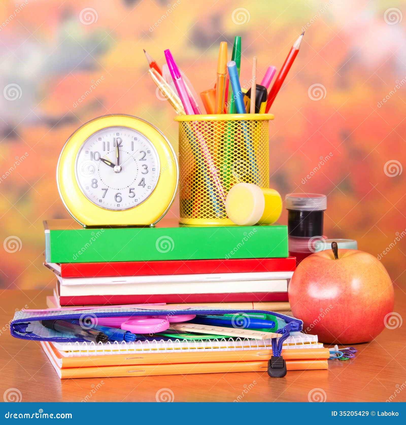 Clock and Stand for Pencils on Stack of Books Stock Image - Image of ...