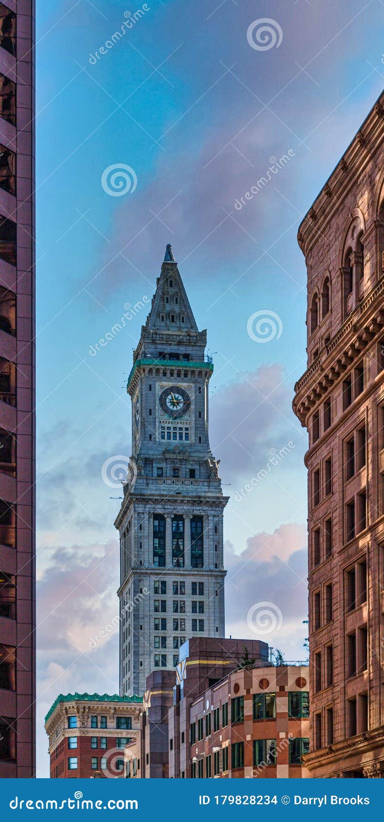 Clock Tower through Buildings Stock Photo - Image of architecture ...