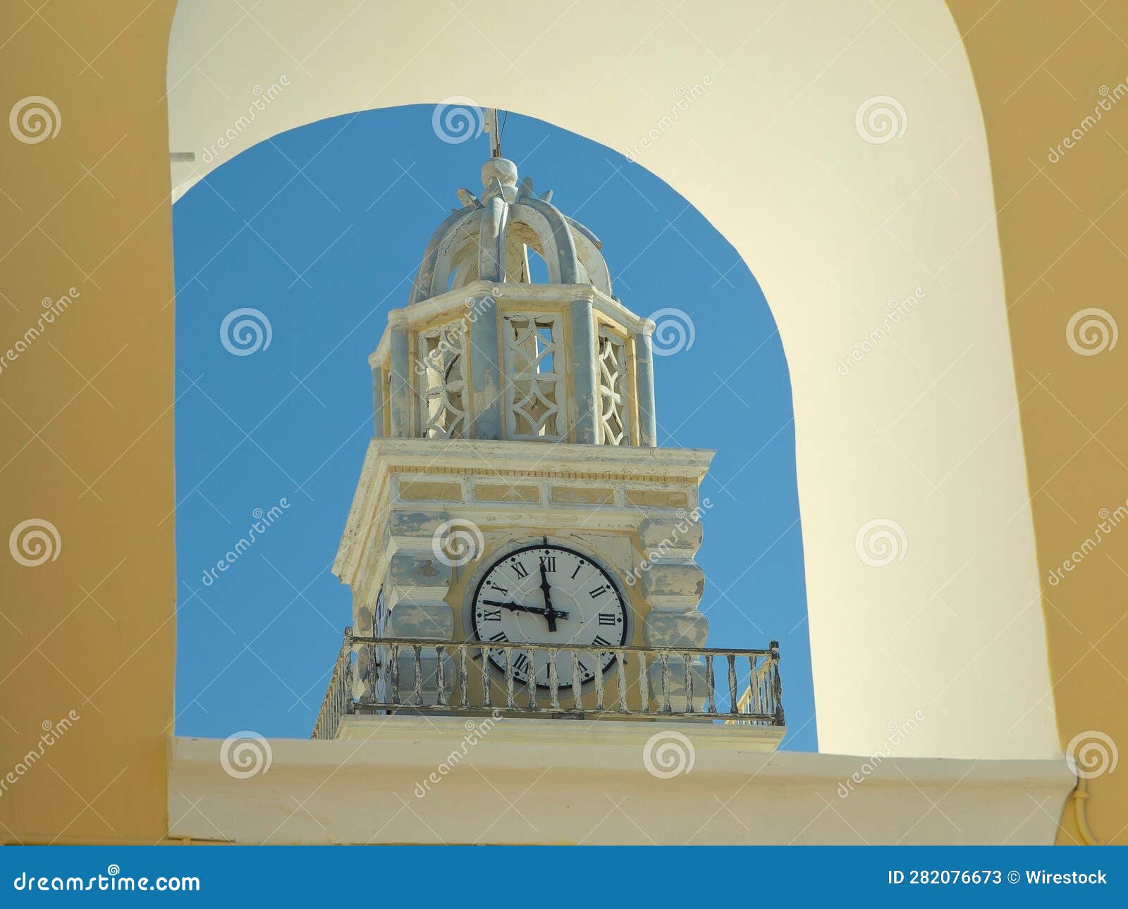 Clock Tower with Dome on Blue Sky Background, Seen through Archway ...