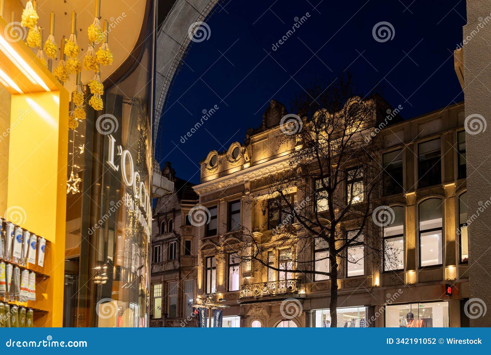 Clock Tower in Front of a Storefront on a Street Corner Editorial ...
