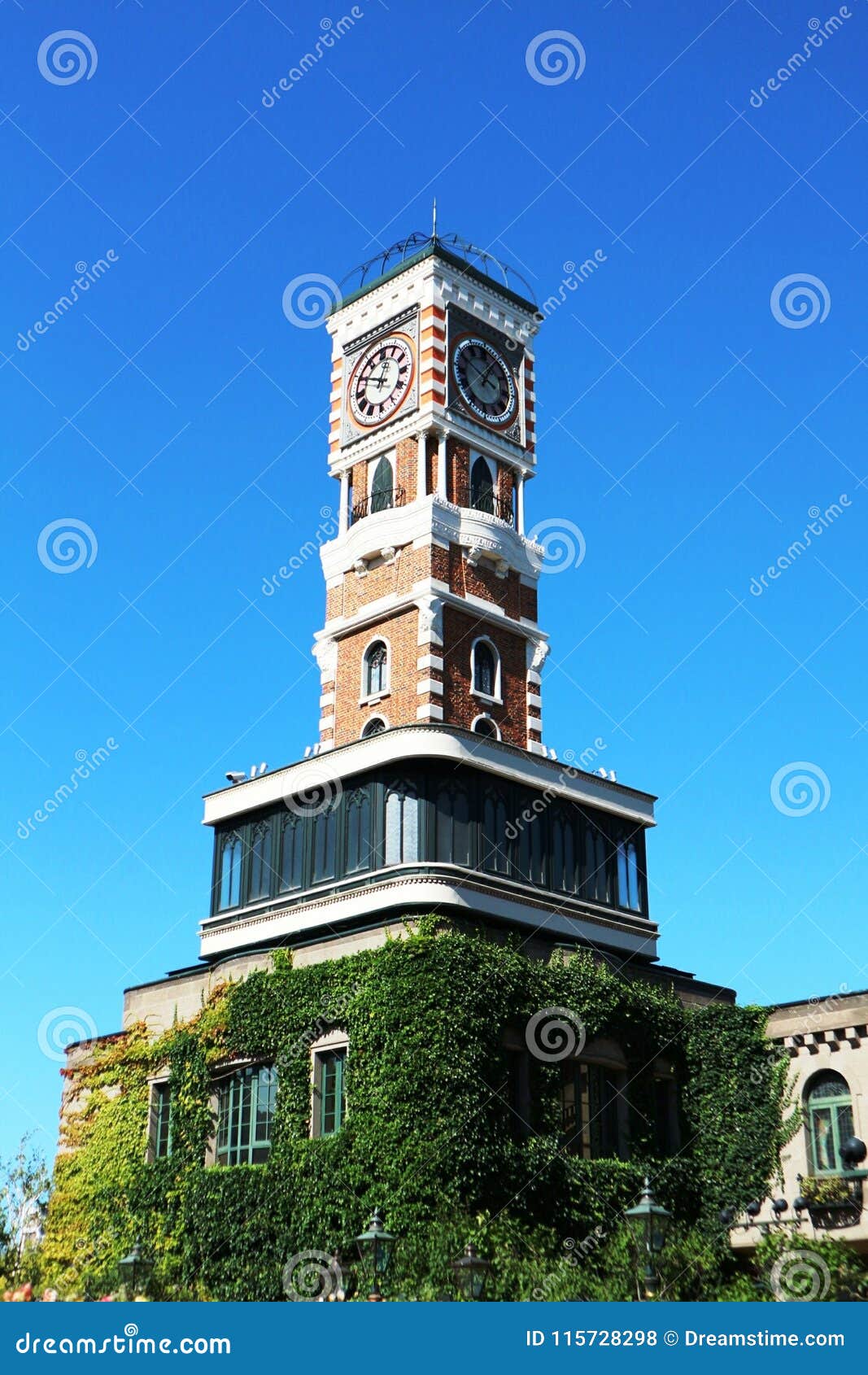 The Clock Tower is Located in the Park on a Clear Blue Day. Stock Photo ...