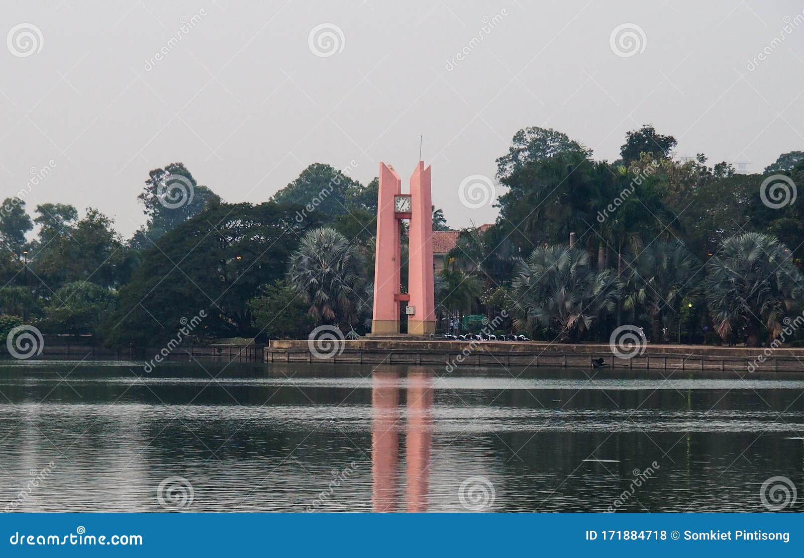 The clock tower at a park stock photo. Image of nature - 171884718