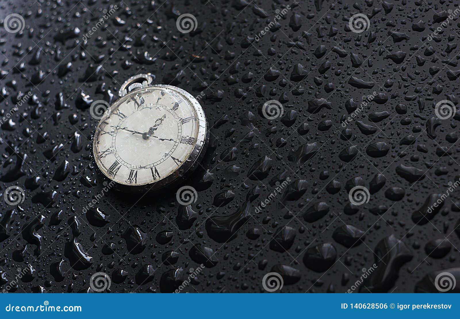 Clock on a Wet Table, Selective Focus in the Foreground with Copy Space ...