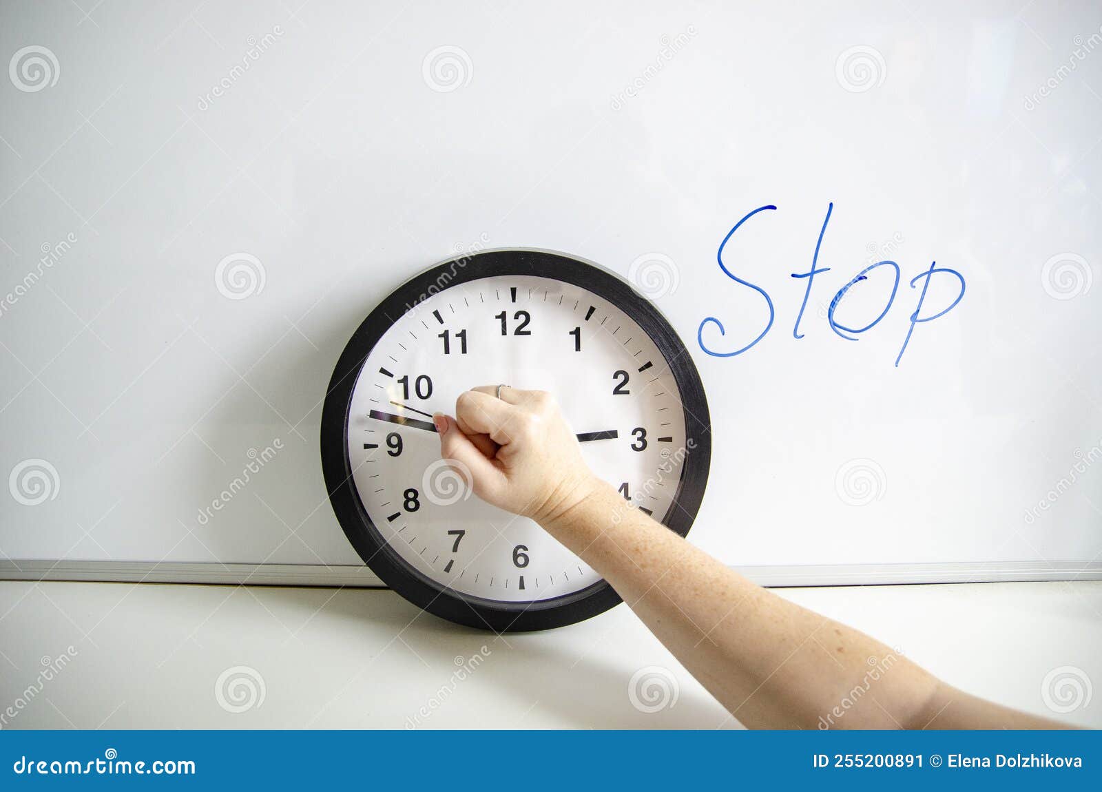 Clock on a White Background Stop Plan Written on the Wall Stock Image ...