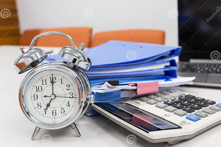 Clock on Work Desk with Calculation, Docutment in the Work Office Time ...