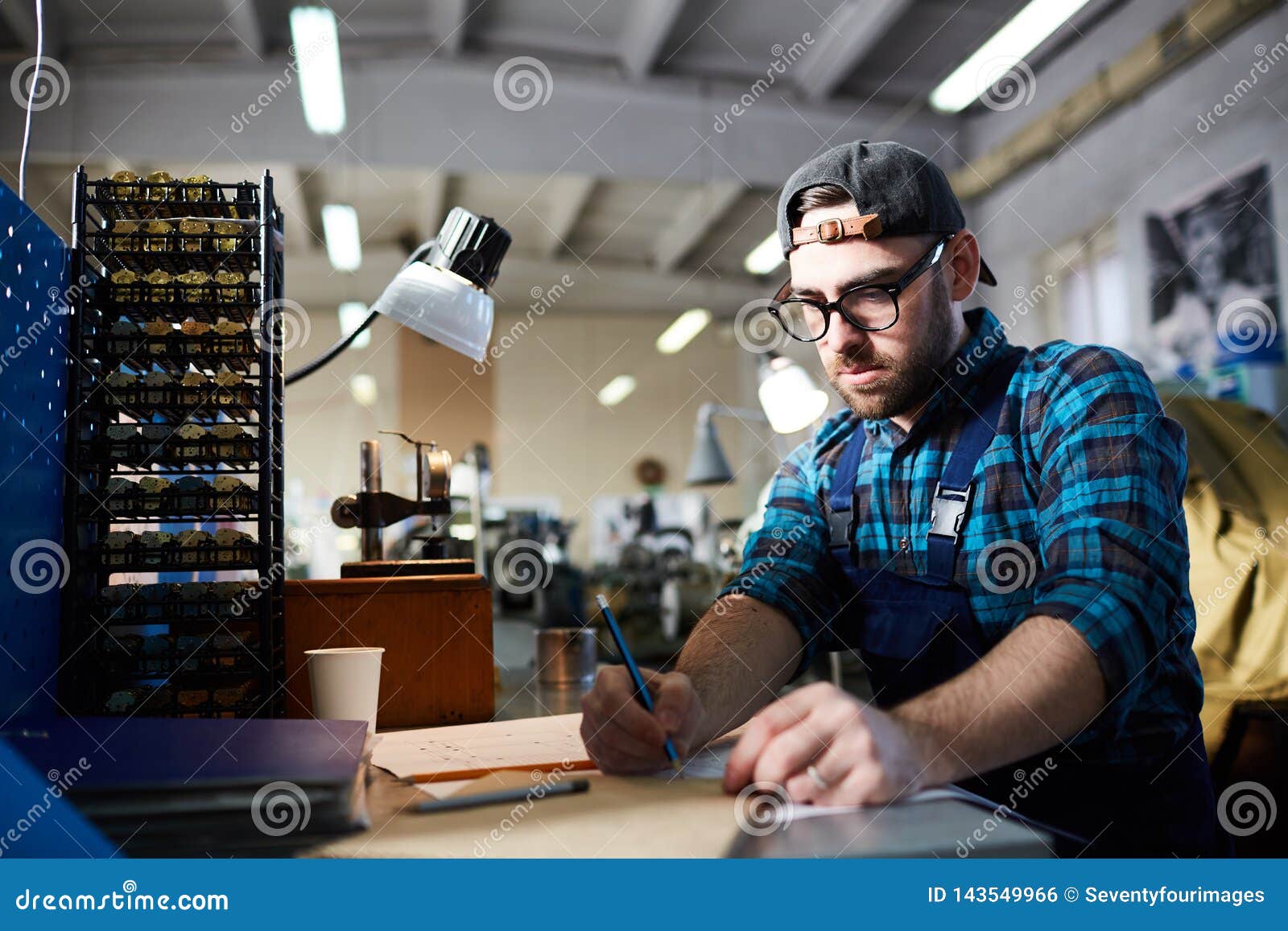Clockmaker at Factory stock photo. Image of plant, sitting - 143549966