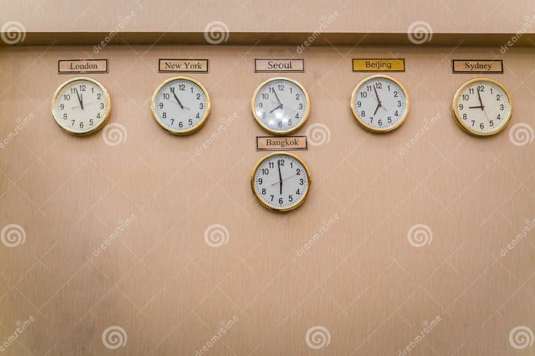 Clocks Shows Different Time Zones on Old Wall . Stock Image - Image of ...