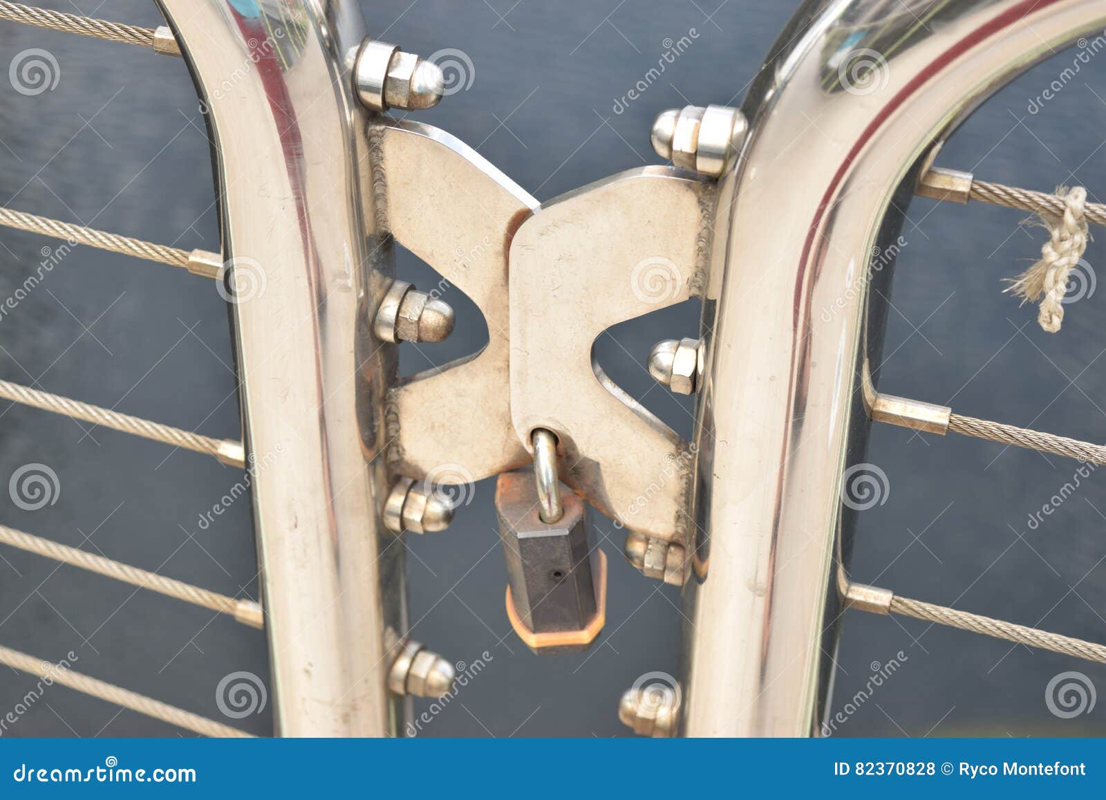 Padlock in between Bridge Hinges Stock Photo - Image of bridge ...