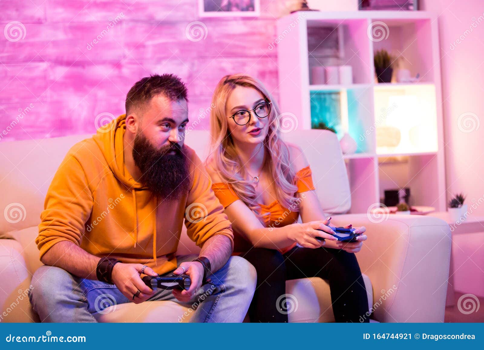 Close Friends Playing Online Game Using Wireless Controller Stock Image ...