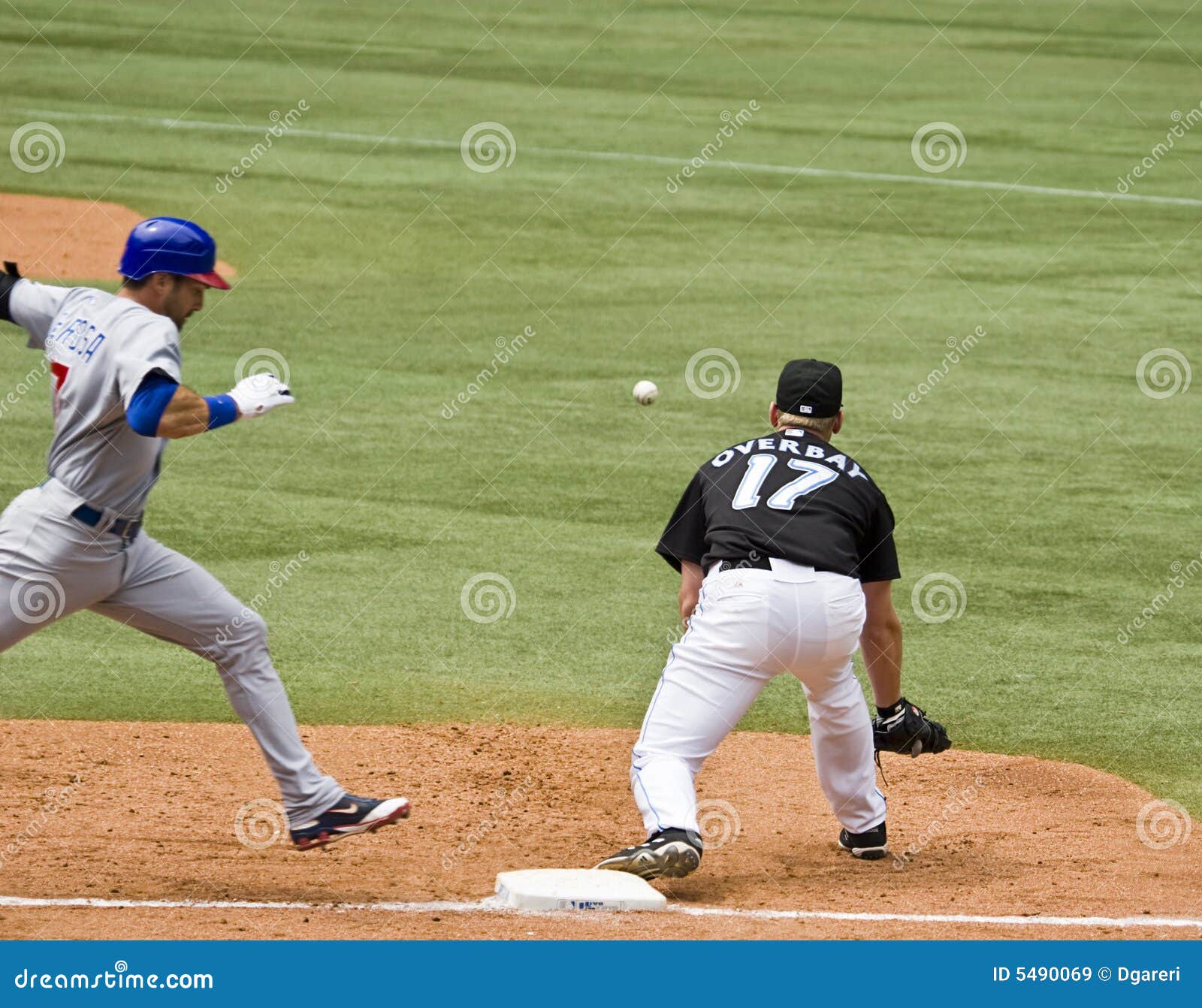 Close play at first base editorial stock image. Image of home - 5490069
