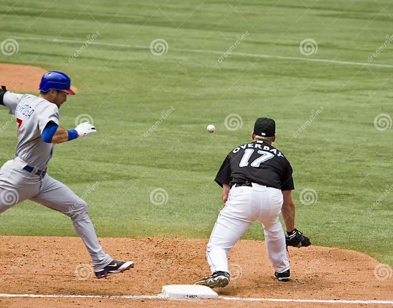 Close play at first base editorial stock image. Image of home - 5490069