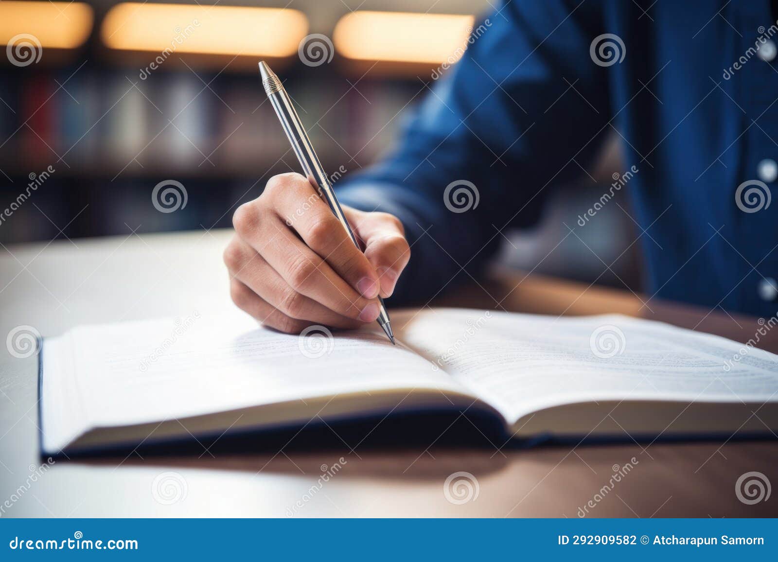 Close Shot of a Human Hand Writing Something on the Paper Stock ...