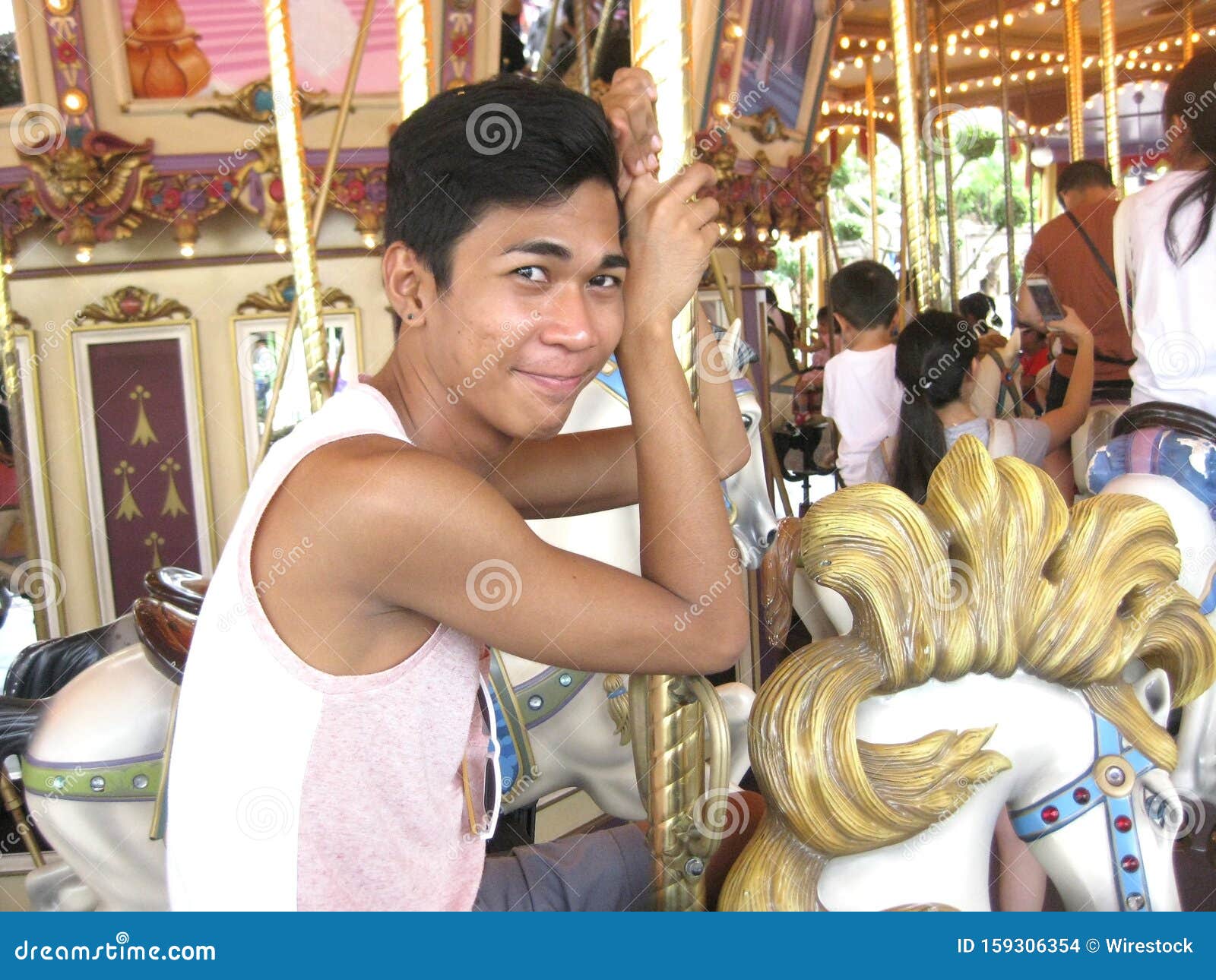 Close Shot of a Male Sitting on a Carousel Stock Photo - Image of ...