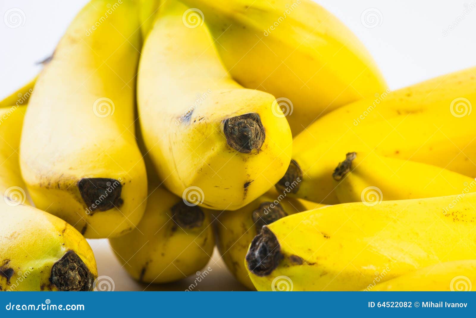 Close Shot of Stacks of Bananas Composed Next To Each Other on a White ...