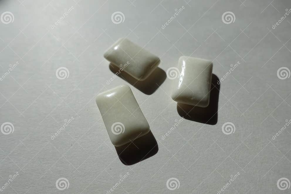 Close Shot of Three White Pieces of Chewing Gum Stock Photo - Image of ...