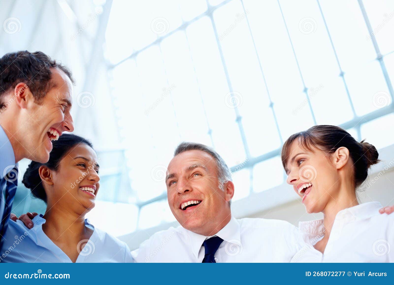 Close Team of Executives Laughing. Low Angle View of Team of Executives ...