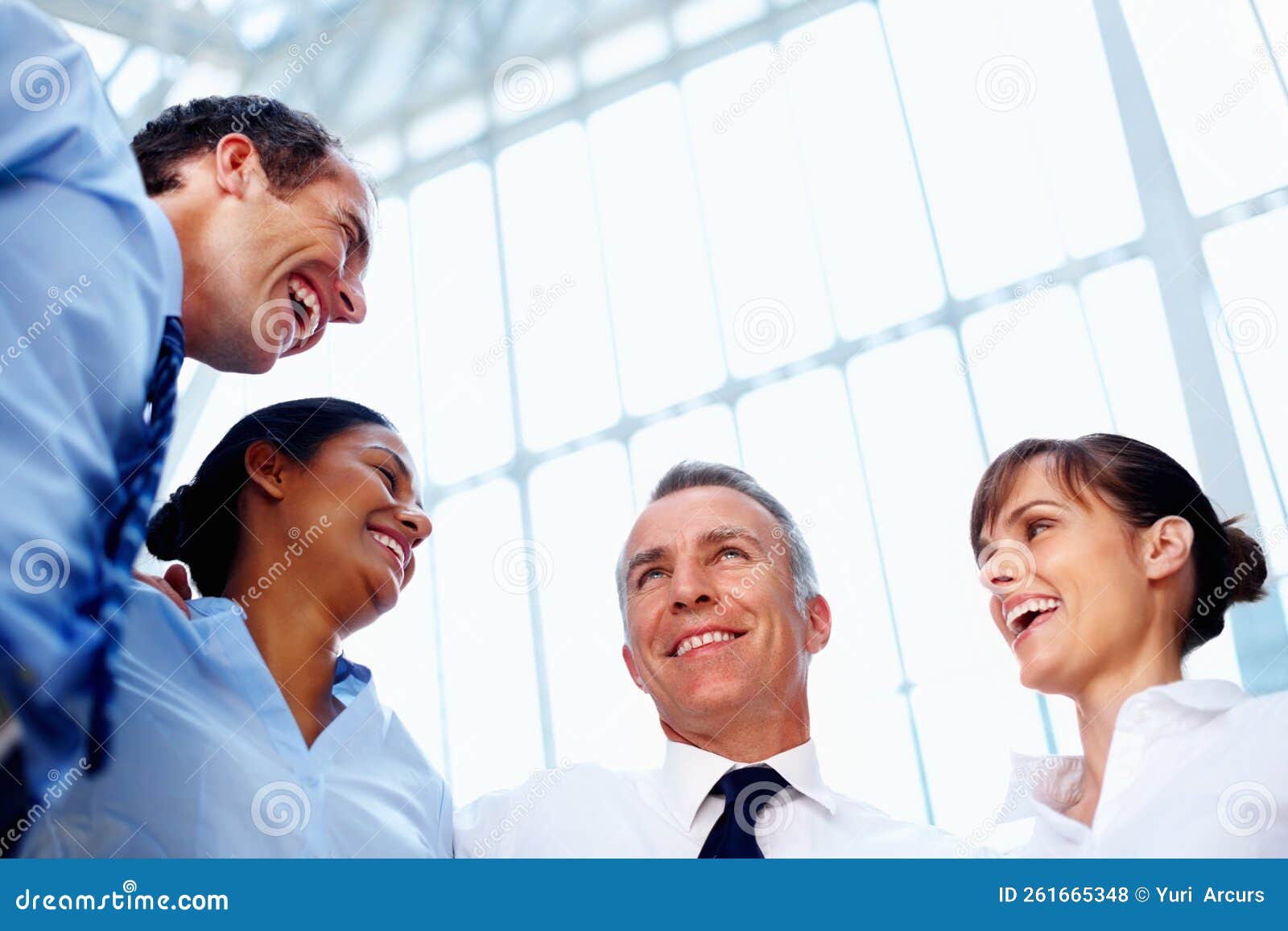 Close Team of Executives Smiling. Low Angle View of Team of Executives ...