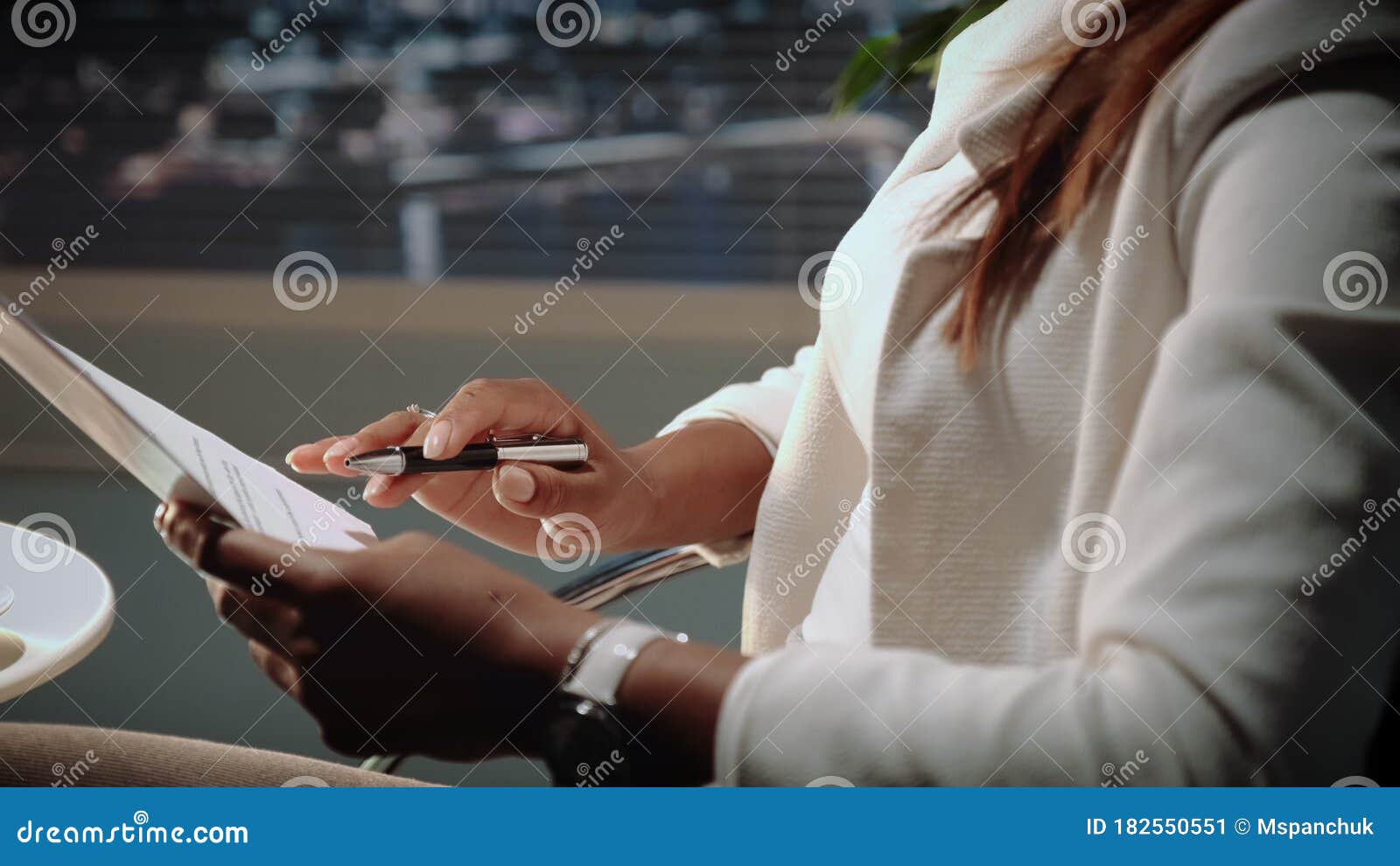 Close Up of African American Business Woman`s Hands Holding Contract ... Close Up of African American Business Woman`s Hands Holding Contract ...
