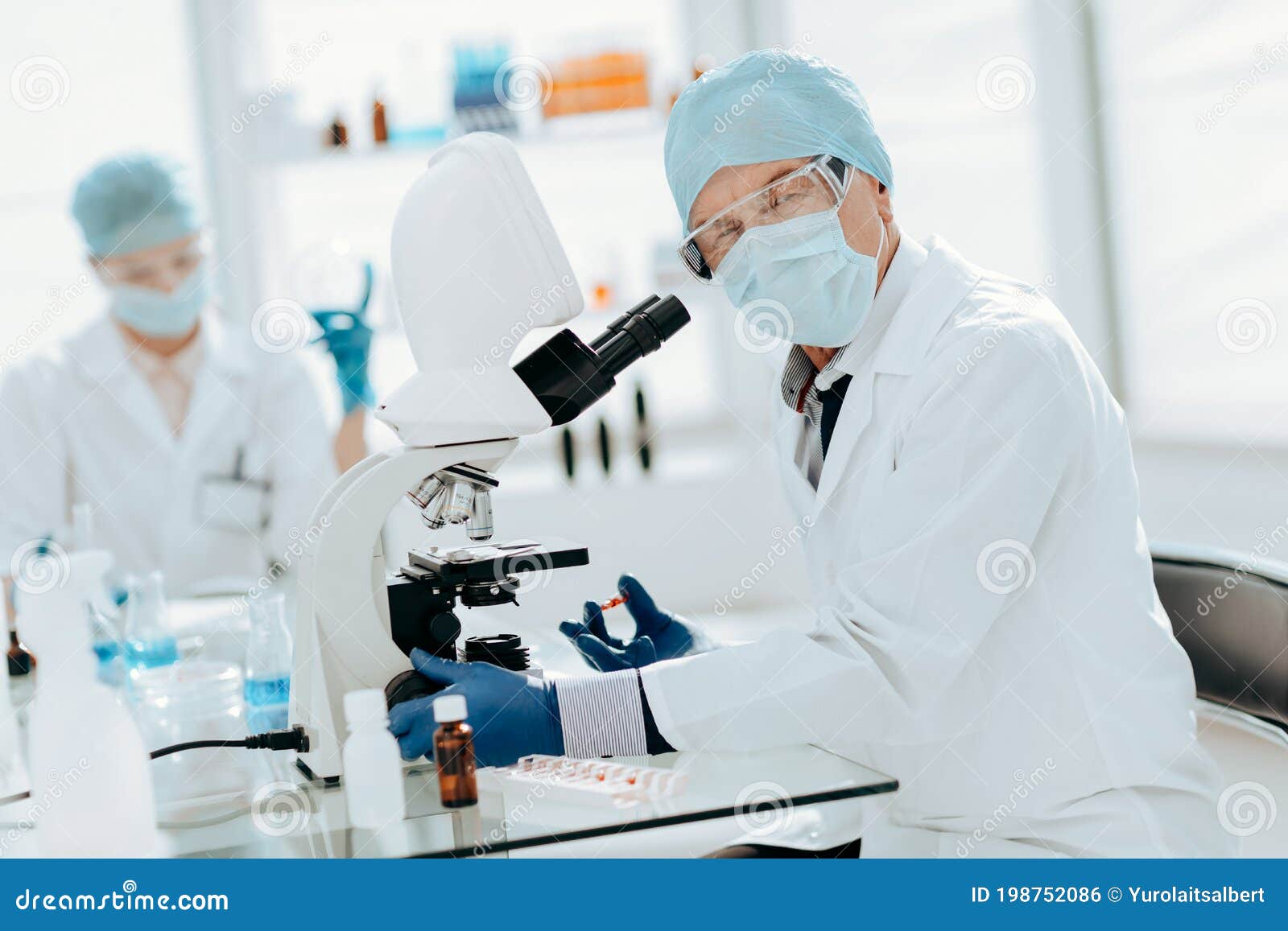 Close Up. Ambitious Scientist Sitting at a Laboratory Table Stock Photo ...