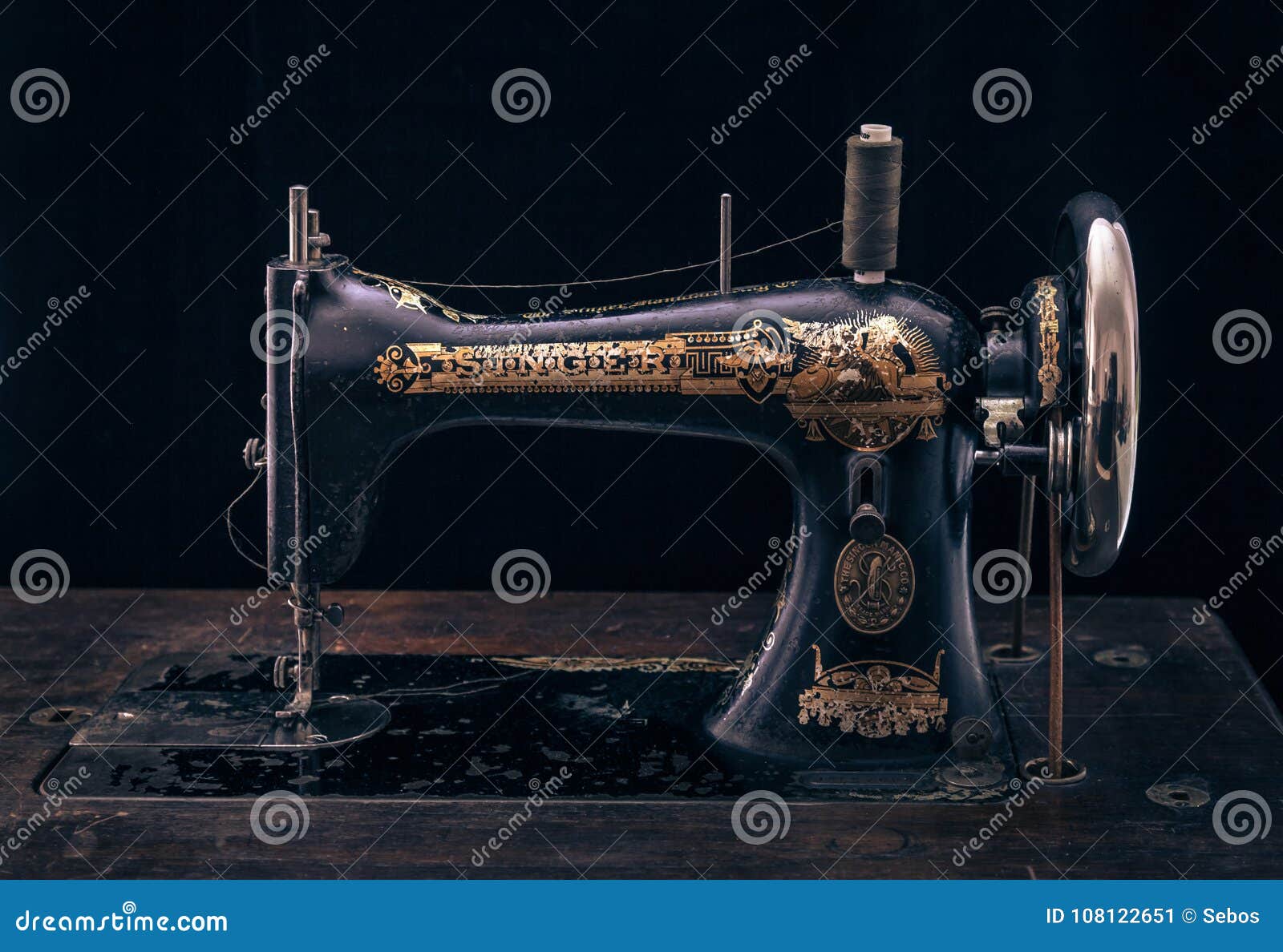 Close Up of Antique Sewing Machine Singer on Black Background ...
