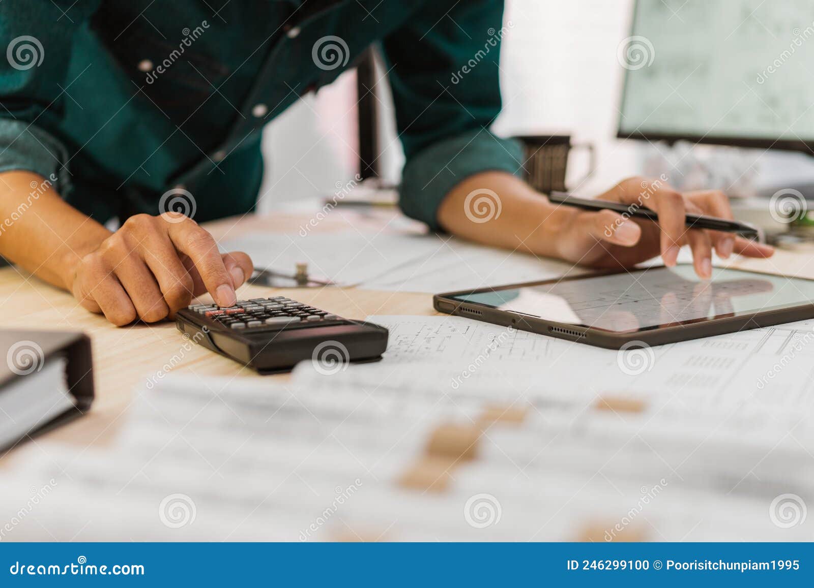 Close Up Architect or Engineer Pressing on Calculator for Calculating ...