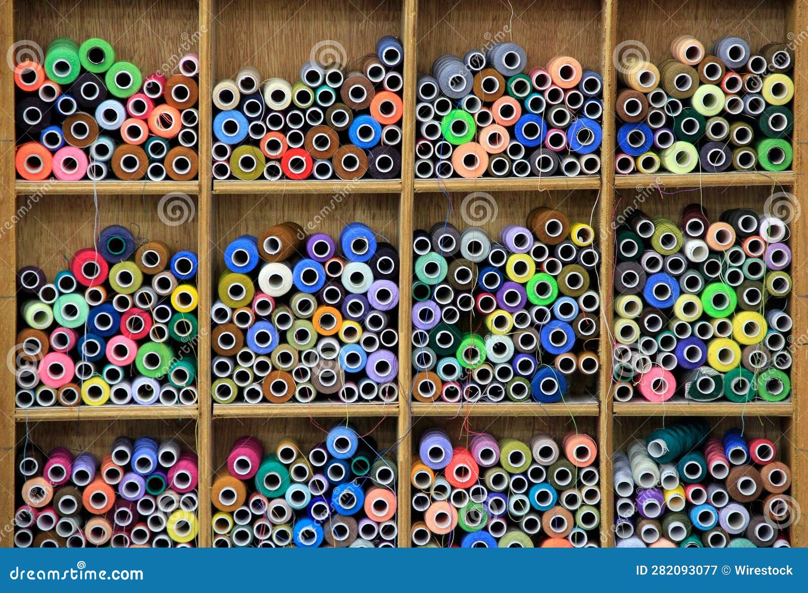 Close Up of an Array of Colorful Spools of Thread in Different Sizes ...