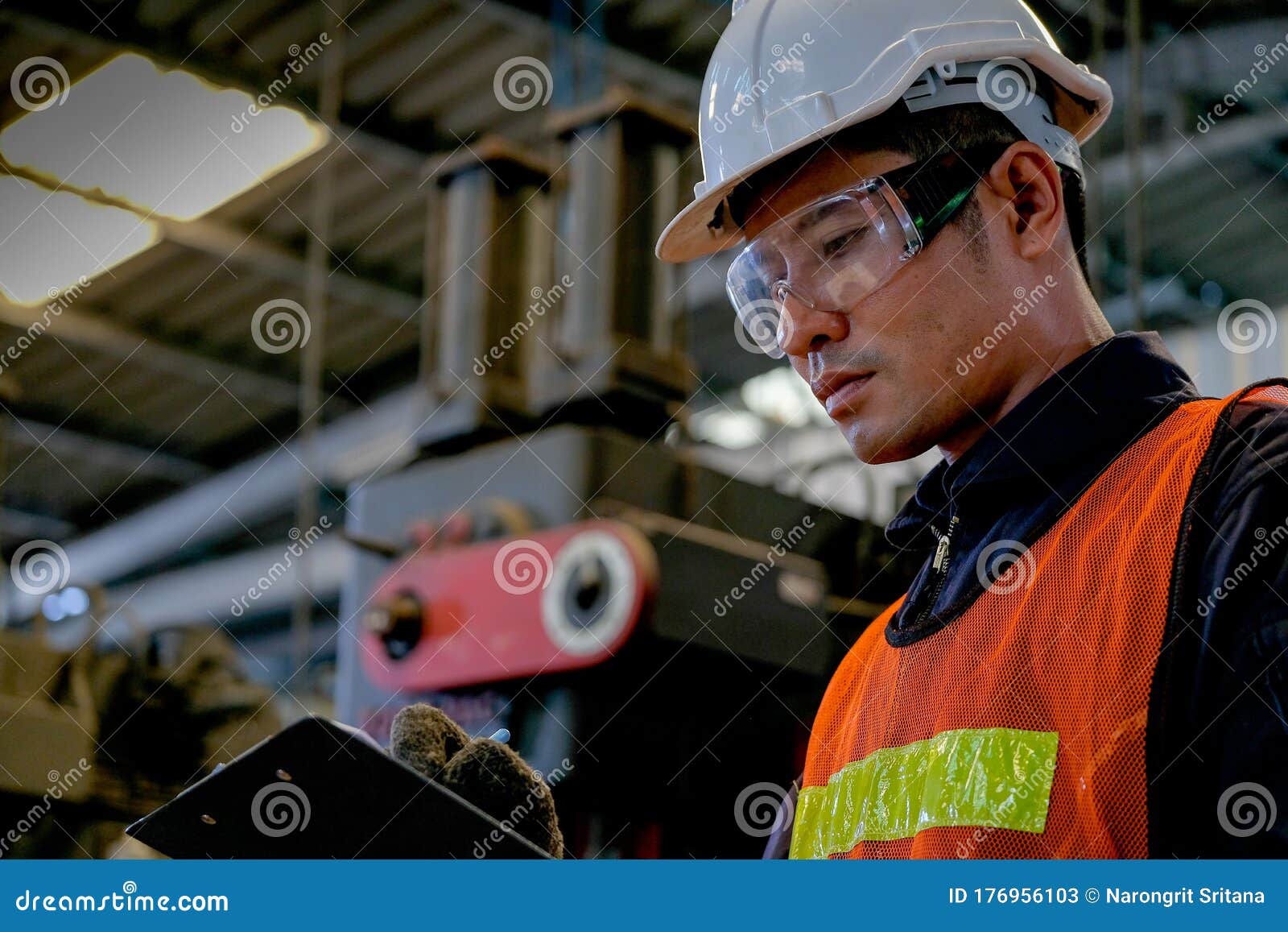 Close Up Asian Worker or Technician Man Write on Document Paper in ...