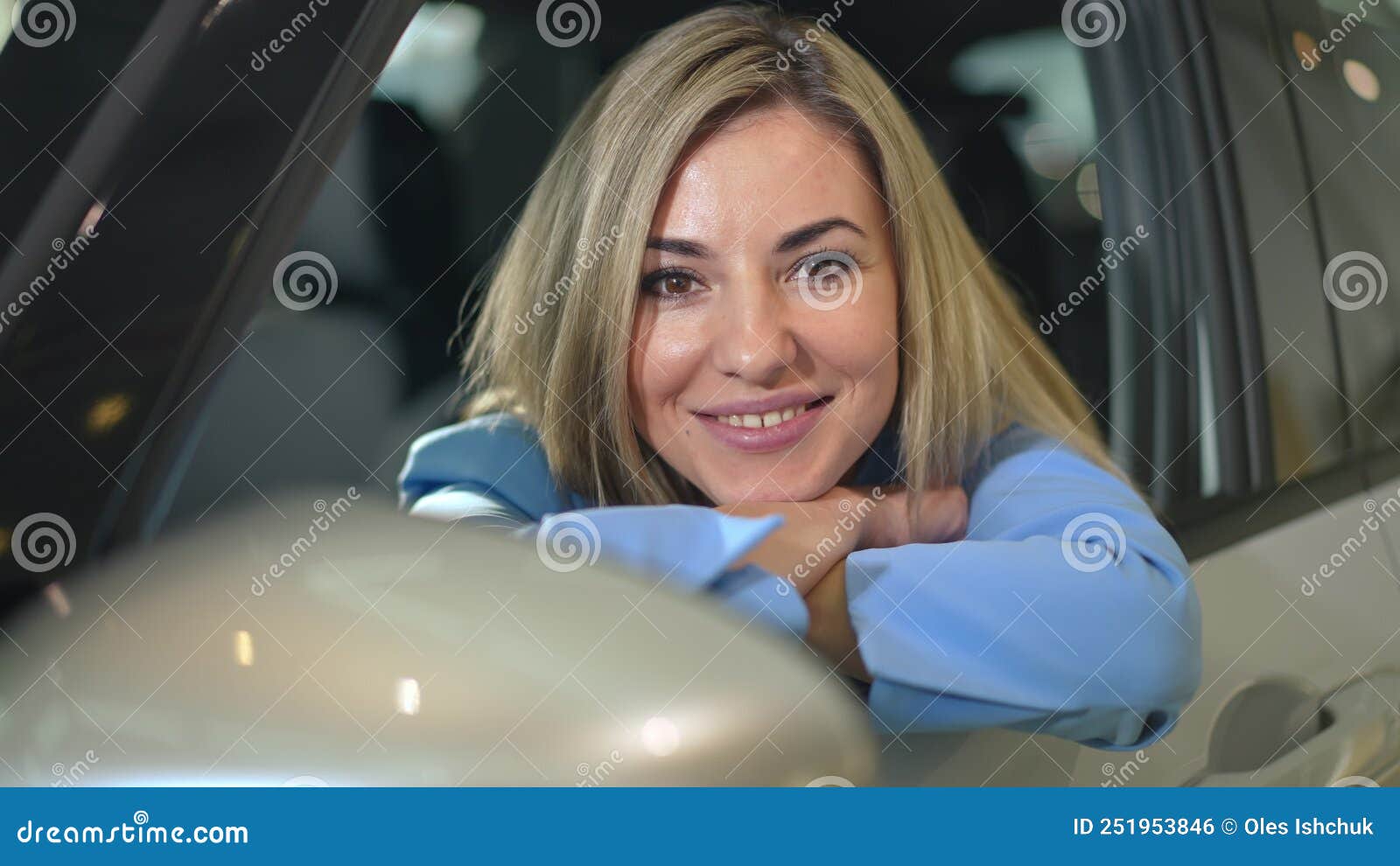 Close Up Attractive Caucasian Woman Looking At Camera Leaning On Car