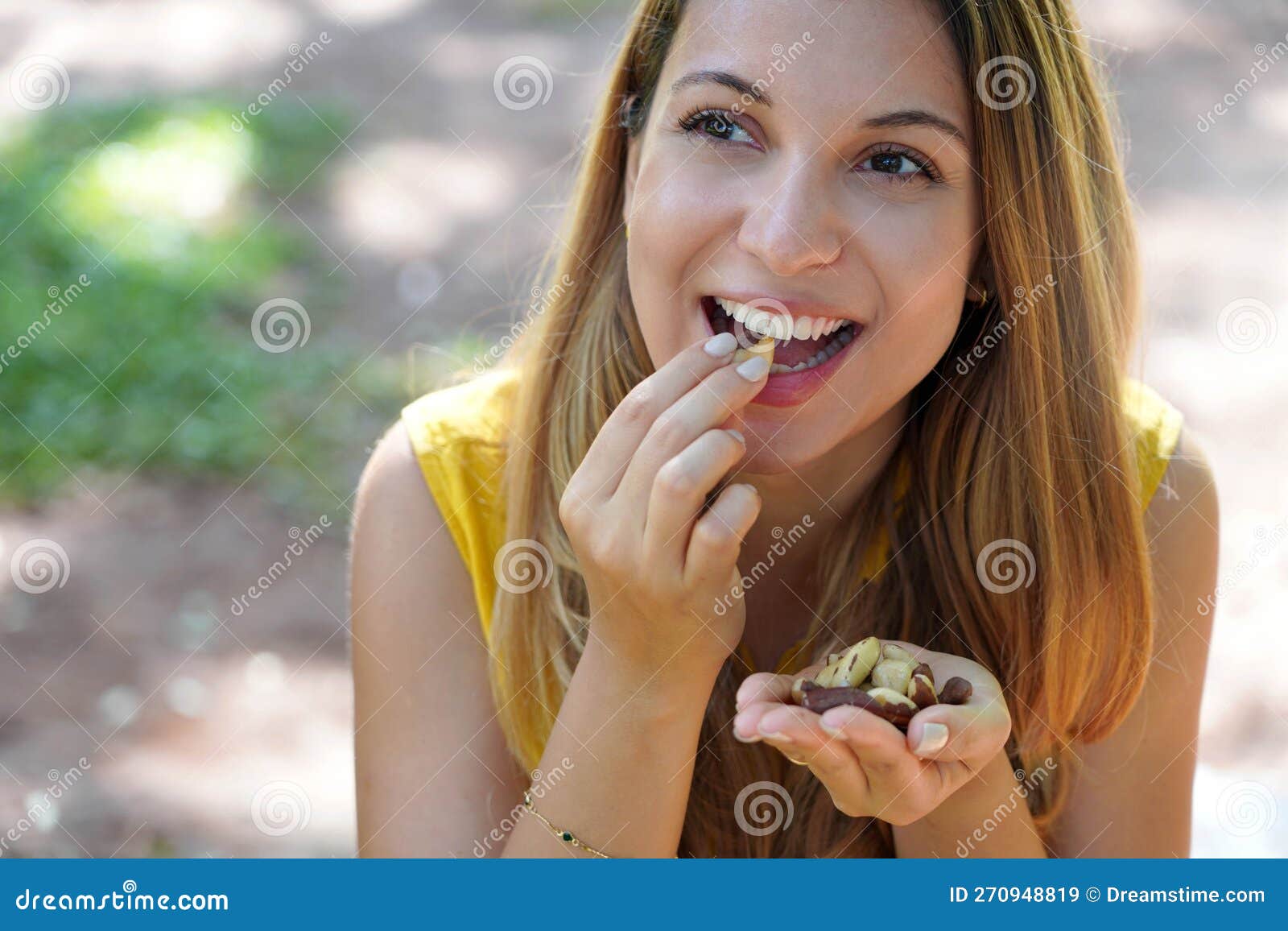 Close Up Of Attractive Healthy Woman Eating Brazil Nuts In The Park Stock Image Image Of Hand 5869