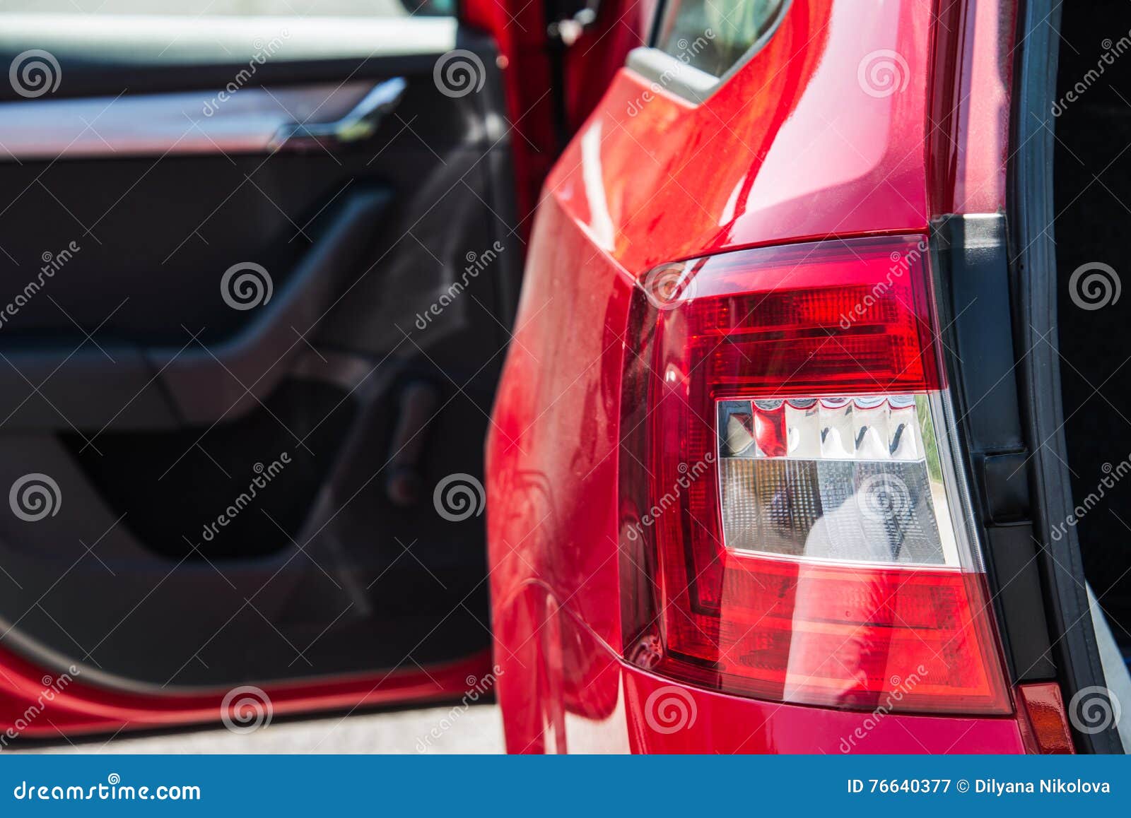 Close Up of a Back Car Light. Red Car with Open Side Door and Trunk ...