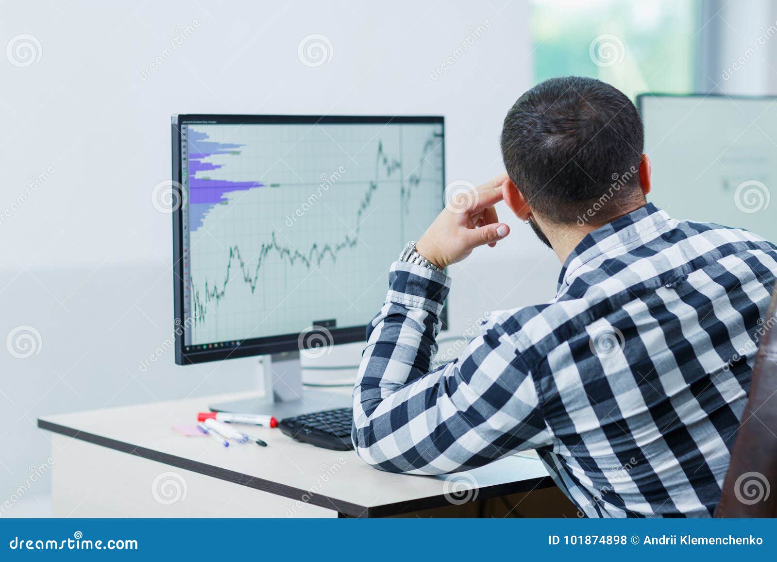 A Man Using Software To Manage Projects on a Laptop Computer Stock ...