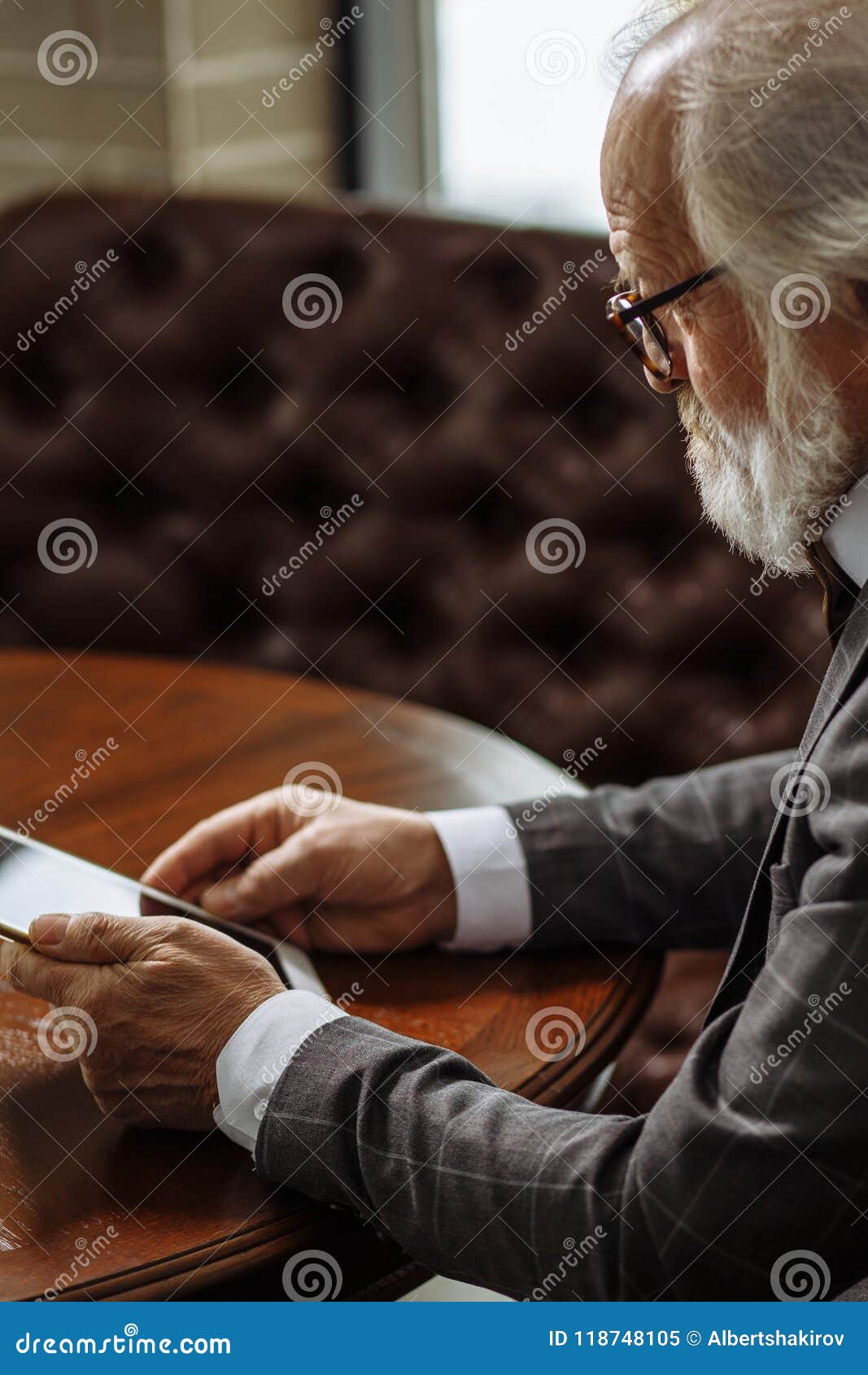 Close Up Back View Short of Elderly Person Entertaining with Gadget ...