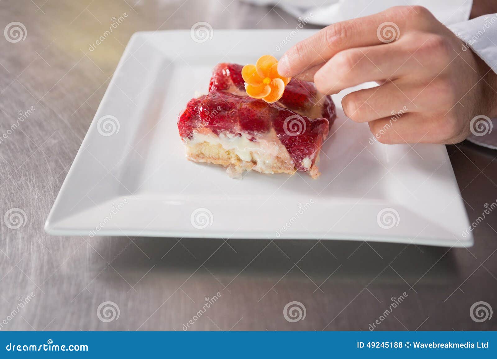 Close Up of Baker Putting Flower on the Pastry with Fruit Stock Photo ...