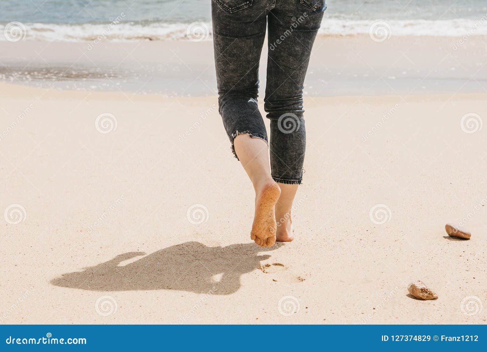 Close Up Of A Barefoot Girl Walking Along The Beach Stock Image Image