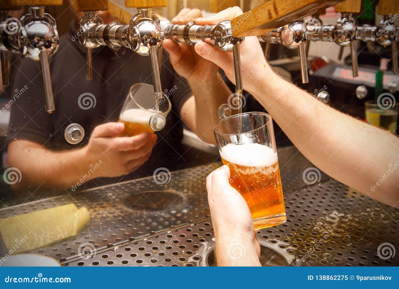Close-up of Bartender Pouring Draft Beer in Glass Stock Image - Image ...
