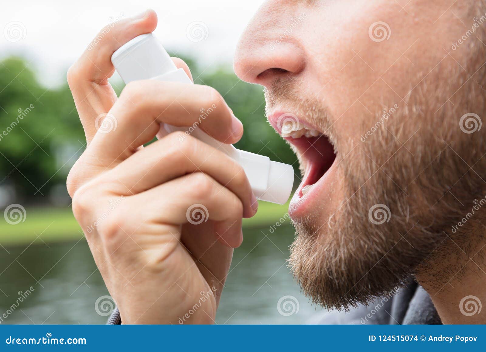 Man Using Asthma Inhaler stock photo. Image of asthma - 124515074