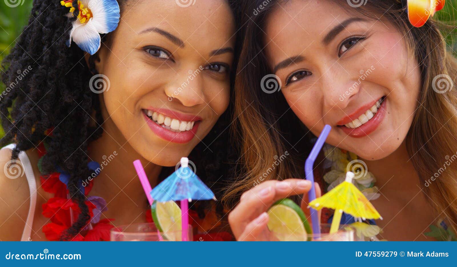 Close Up Of Beautiful African American And Asian Women On Vacation