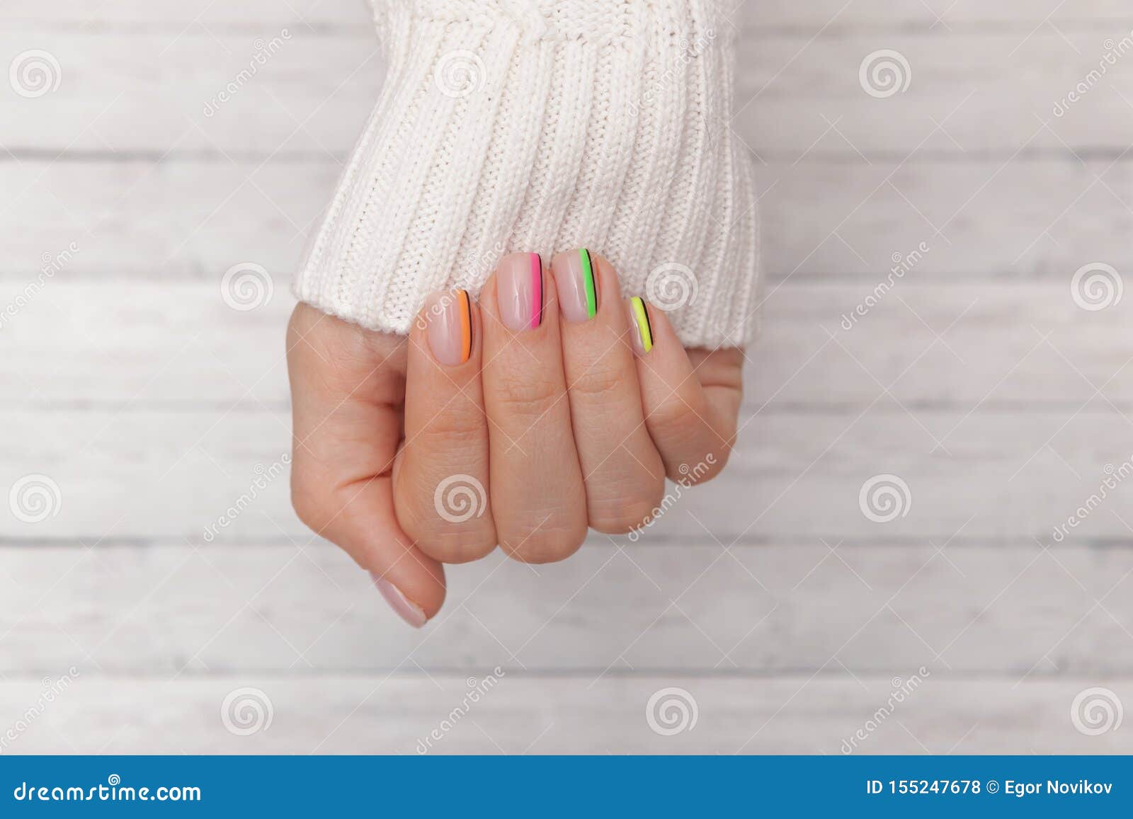 Close Up Beautiful Groomed Woman`s Hands With Colored Nails On The