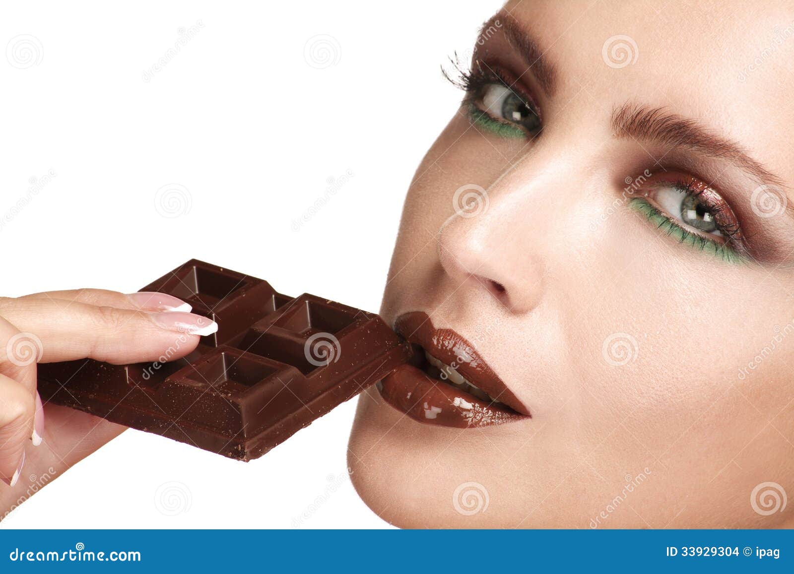 Close Up of a Beautiful Model Tasting Dark Chocolate Stock Photo ...