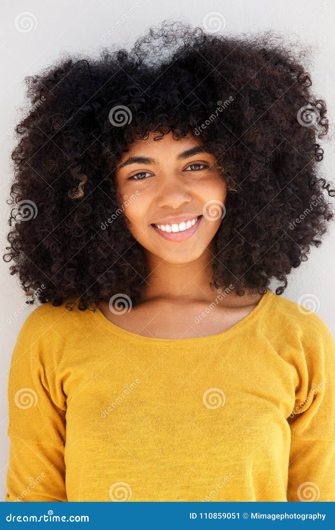 Close Up Beautiful Young Black Woman With Curly Hair Against White