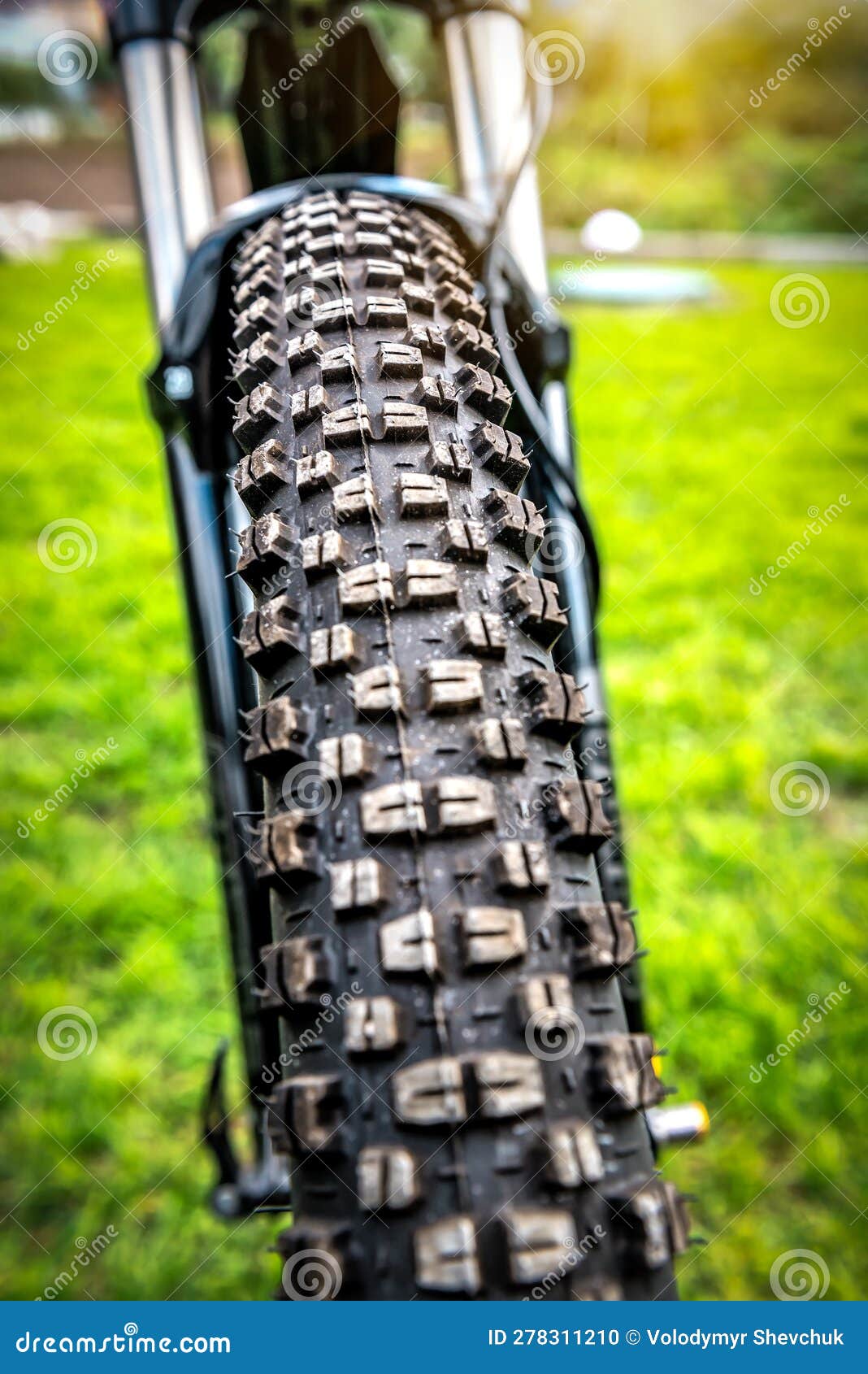 Close Up of Bicycle Tire on Green Grass Background Stock Photo - Image ...