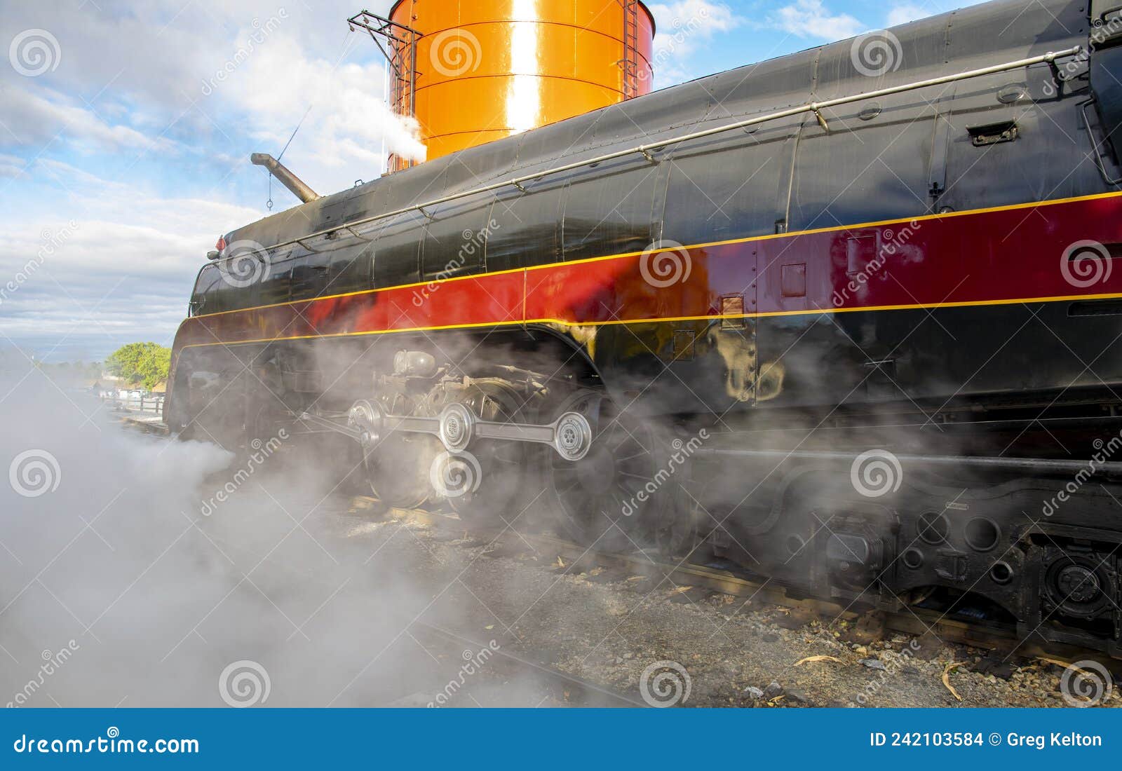 Close Up of a Big Restored Steam Engine Passing by Blowing Lots of ...