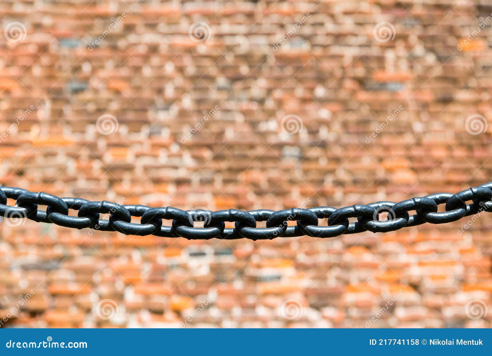 Close Up of Black Chain on Blurred Red Brick Wall Background Stock ...