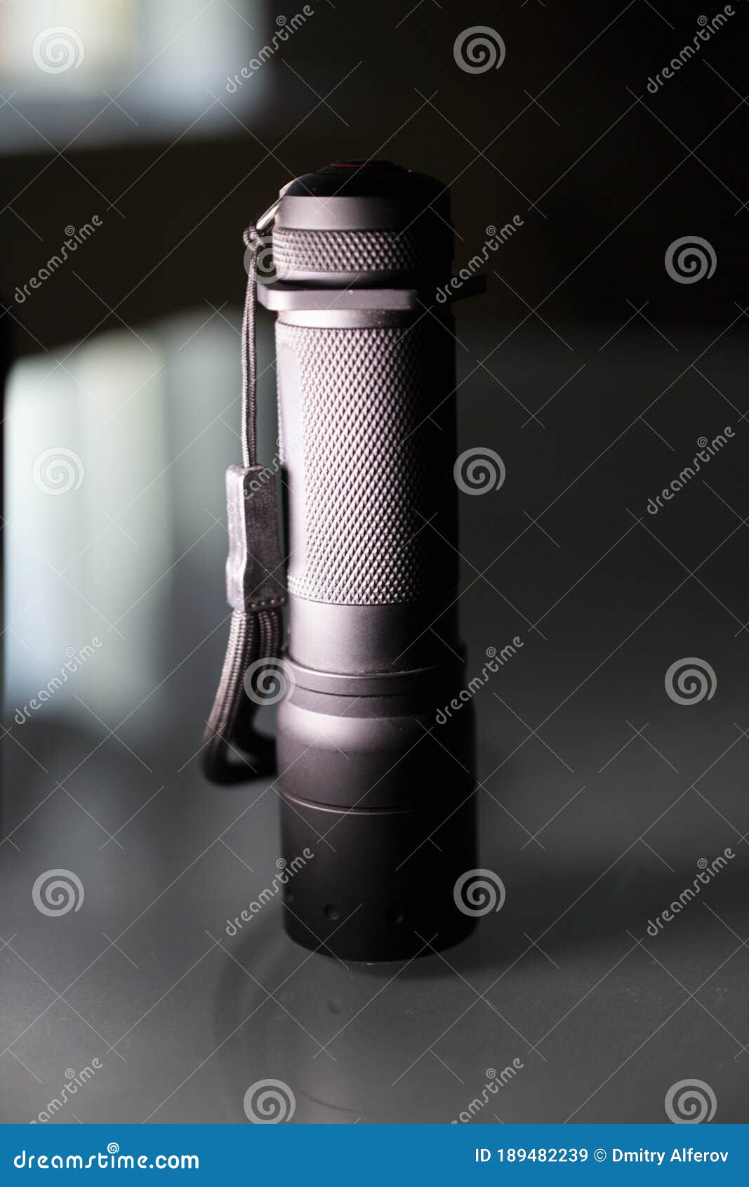 Close-up of the Black LED Flashlight on the Table Stock Image - Image ...
